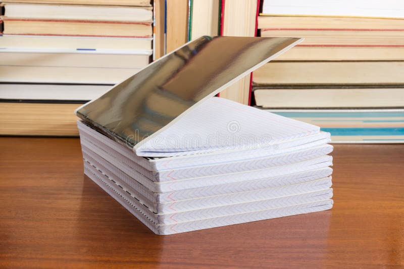 Stack of Different Exercise Books on Table Against of Books Stock Photo ...