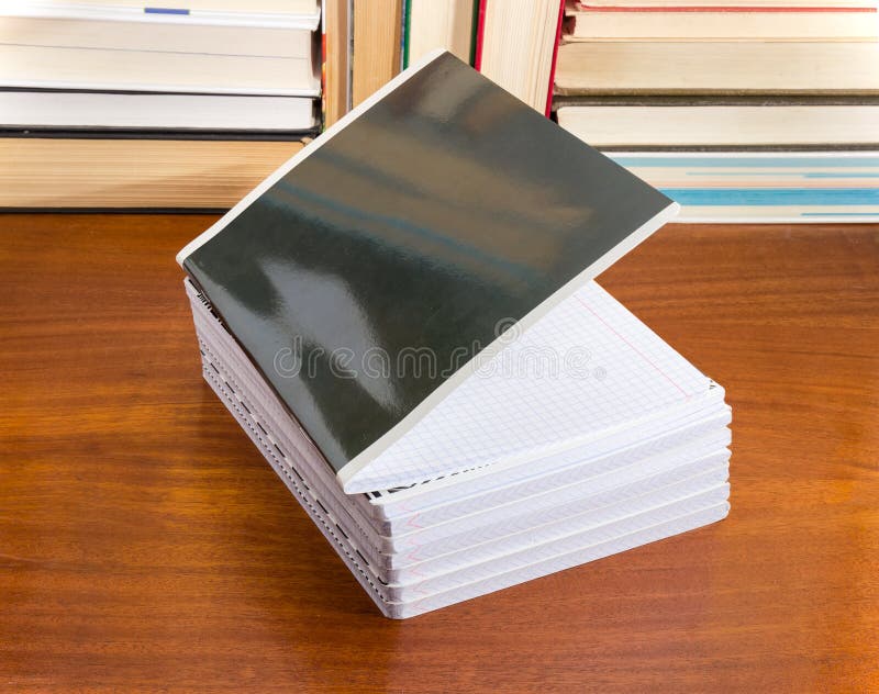 Stack of Different Exercise Books on Table Against of Books Stock Photo ...