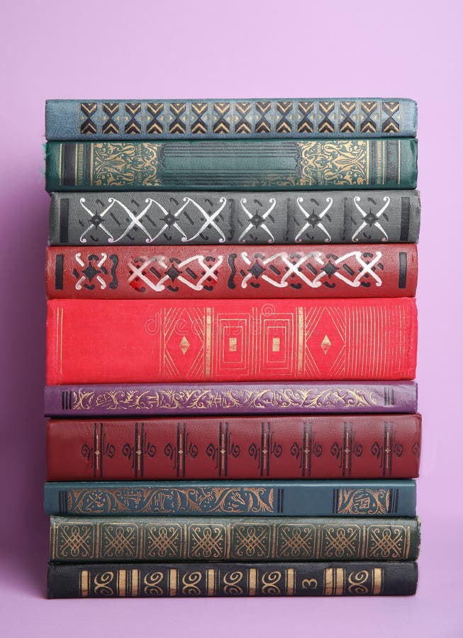 Stack of Different Hardcover Books on Violet Stock Photo - Image of ...