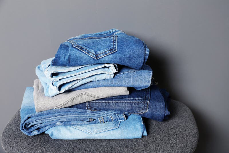 Stack of Different Jeans on Stool Stock Photo - Image of denim, garment ...