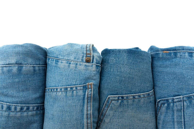Stack of Different Jeans on a White Background. Denim Background ...
