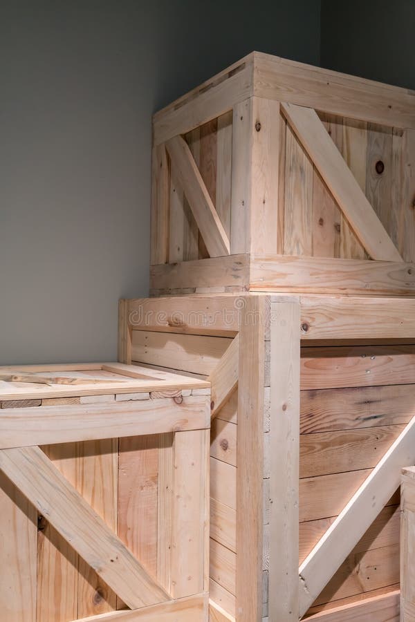 Stack of Different Sizes of Wood Boxes Against White Wall Stock Photo ...