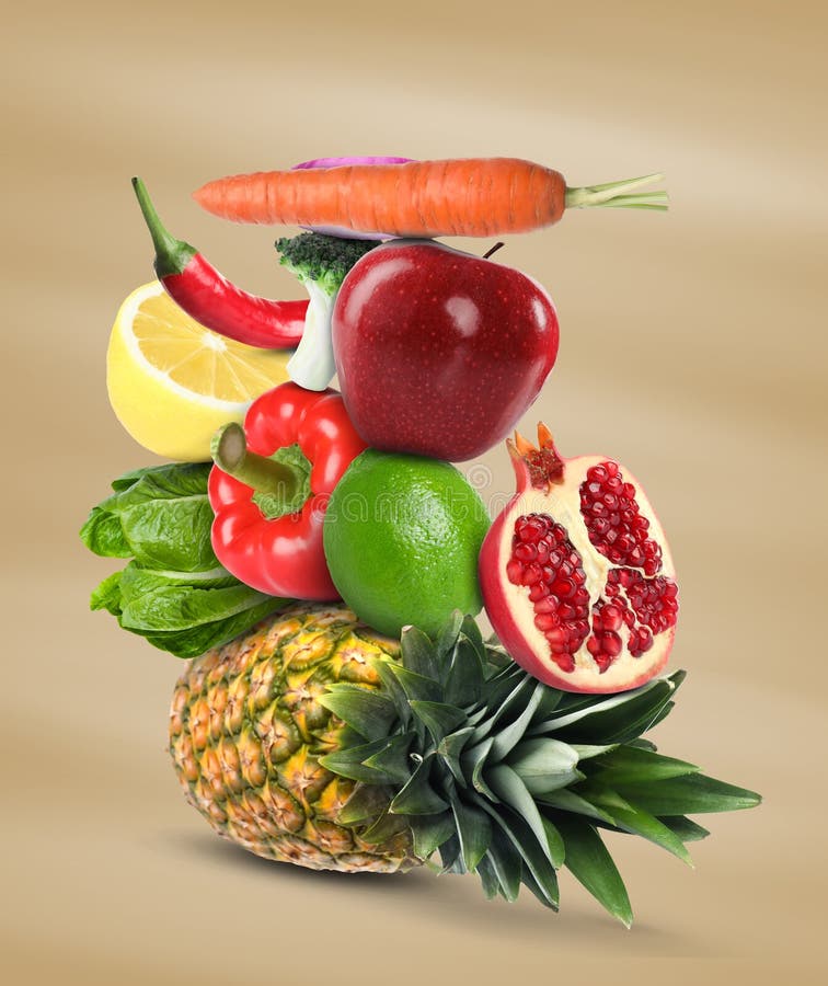 Stack of Different Vegetables and Fruits on Pale Light Brown Background ...