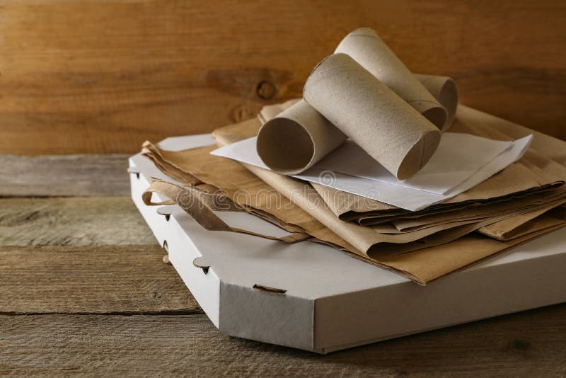 Stack of Different Waste Paper on Wooden Table, Closeup. Space for Text ...