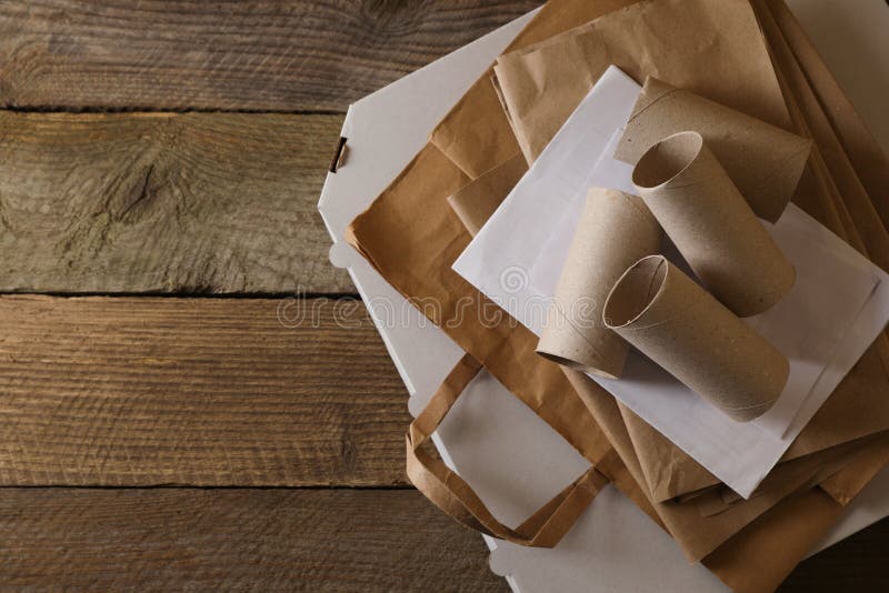 Stack of Different Waste Paper on Wooden Table, Flat Lay. Space for ...