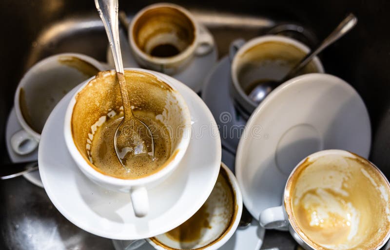 Stack of Dirty Coffee Cups with Spoons in a Kitchen Sink Stock Photo ...
