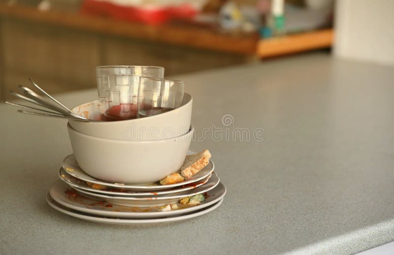 Stack of Dirty Dishes with Food Leftovers on the Table after Meal ...