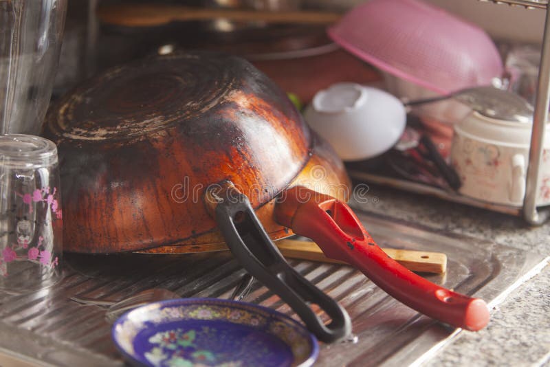 Stack of Dirty in the Sink , Stack of Used Frying Pans, Sink Full of ...