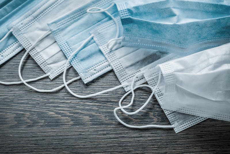Stack of Disposable Face Masks on Vintage Wooden Board Stock Photo ...
