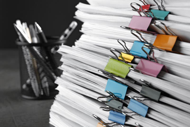 Stack of Documents with Binder Clips on Grey Stone Table Stock Image ...