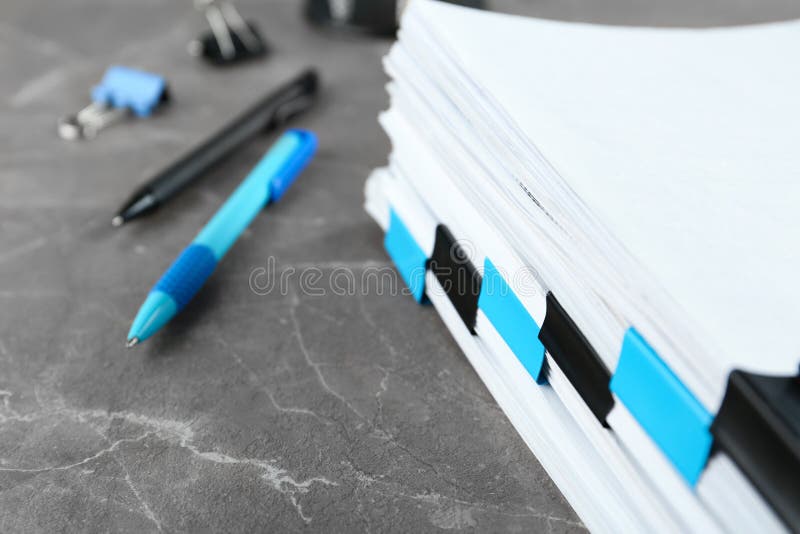 Stack of Documents with Binder Clips on Grey Stone Table. Space for ...