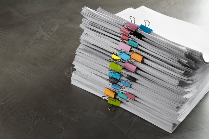 Stack of Documents with Binder Clips on Grey Stone Table Stock Image ...