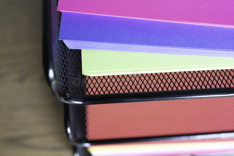 Stack of Documents on Brightly Colored Paper on Stacked Tray on Office ...
