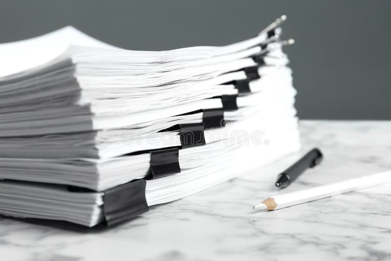 Stack of Documents with Clips on Marble Table, Closeup Stock Photo ...