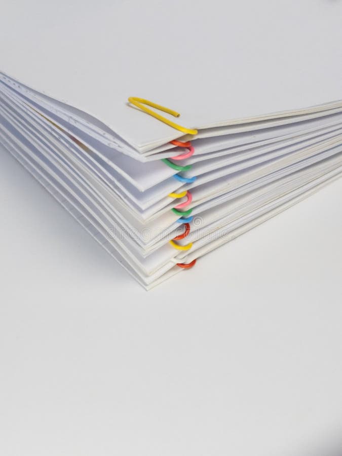 Stack of Documents Held Together by Colorful Paper Clips on White ...