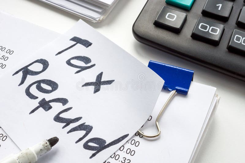 A Stack of Documents Tax Refund and a Sticker on it. Stock Image ...