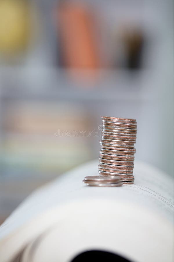 A Stack of Dollar Coins on a Book Stock Photo - Image of capital ...