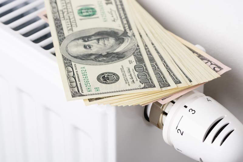 Stack of Dollar Money Banknotes on Heating Radiator Battery with ...