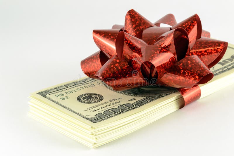 A Stack of Dollars and a Red Gift Bow Stock Photo - Image of currency ...