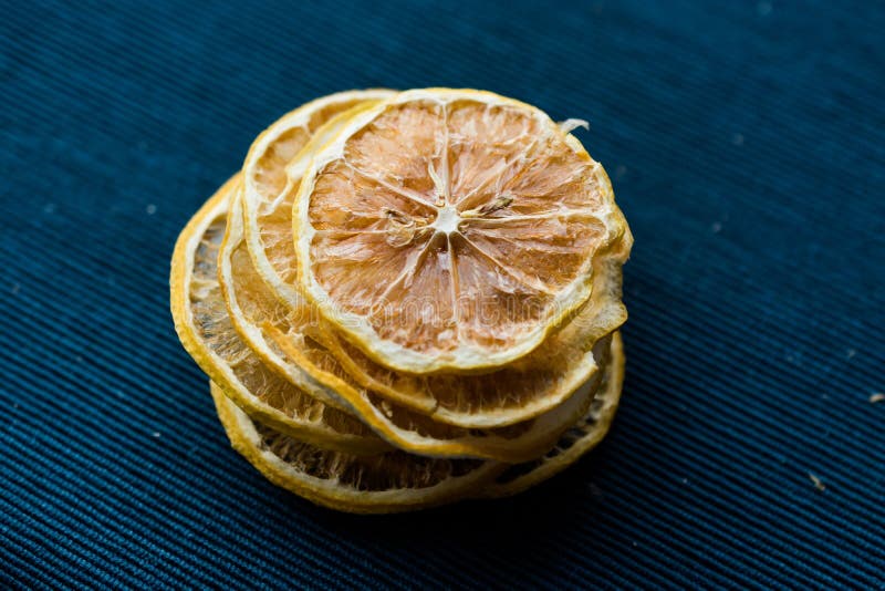 Stack of Dried Lemon Slices on Blue Surface / Dry and Sliced. Stock ...