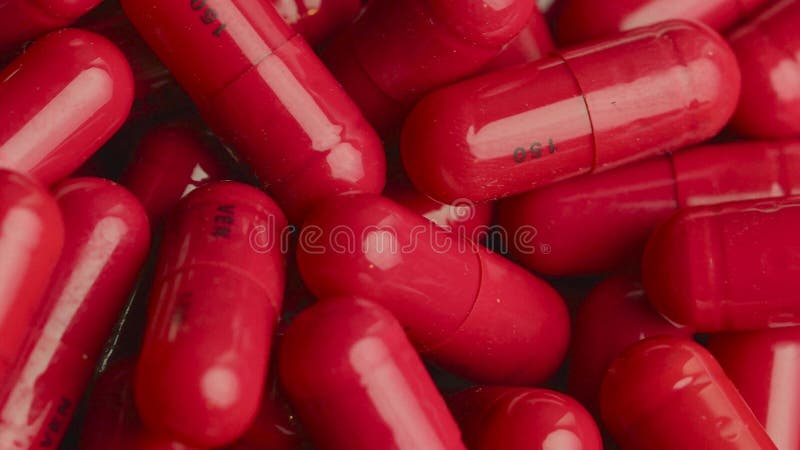 A Stack of Drugs, Pills. Red Medical Tablets. Medication on a Rotating ...