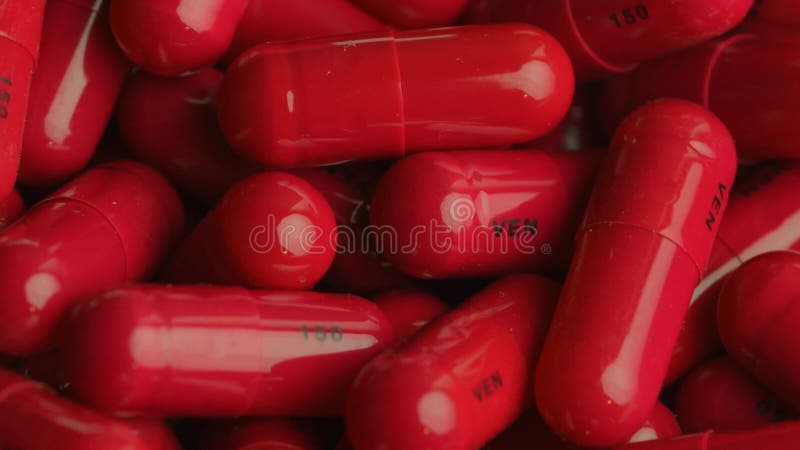 A Stack of Drugs, Pills. Red Medical Tablets. Medication on a Rotating ...