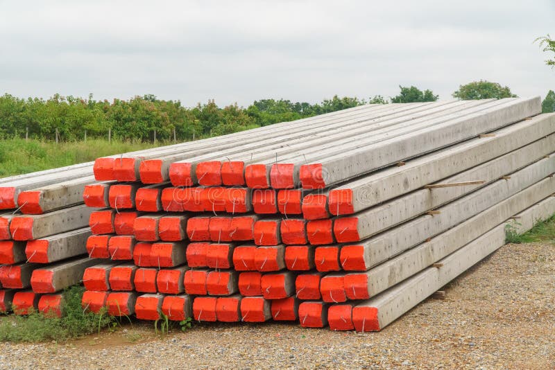 Stack of Electrical Concrete Poles Stock Image - Image of ground ...