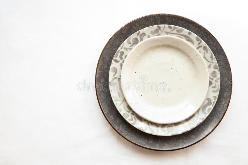 Stack of Empty Ceramic Plates Isolated on White Background with Stock ...