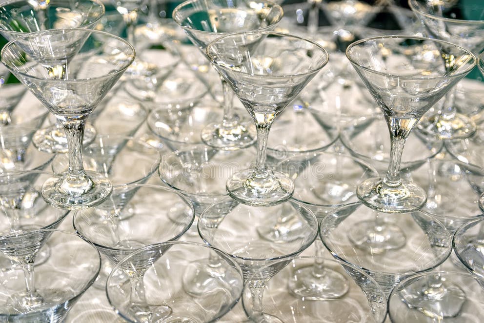 Stack of Empty Champagne Glasses on the Table in Restaurant. Selective ...