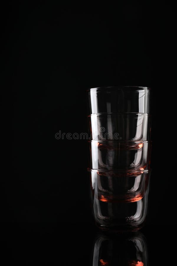 Stack of Empty Colorful Whiskey Glasses on Black , Space for Text Stock ...