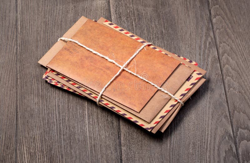 Stack of Envelopes on Wooden Stock Photo - Image of envelope, table ...