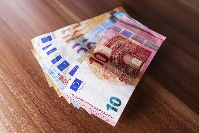 Stack of Euro Banknotes on the Table. 10, 20 and 50 Euro Banknotes in a ...