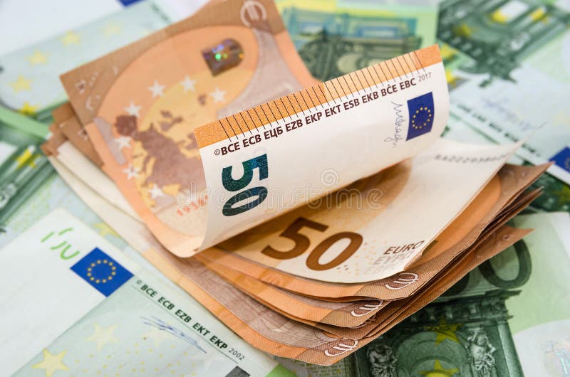 Stack of 50 Euros on a Background of Euro Banknotes. Stock Photo ...