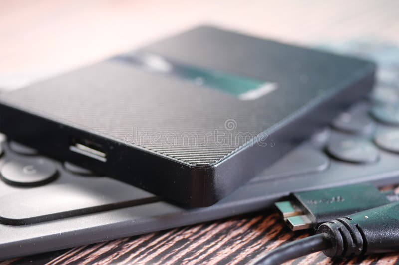 External Hard Drives on a Keyboard on Table Stock Photo - Image of ...