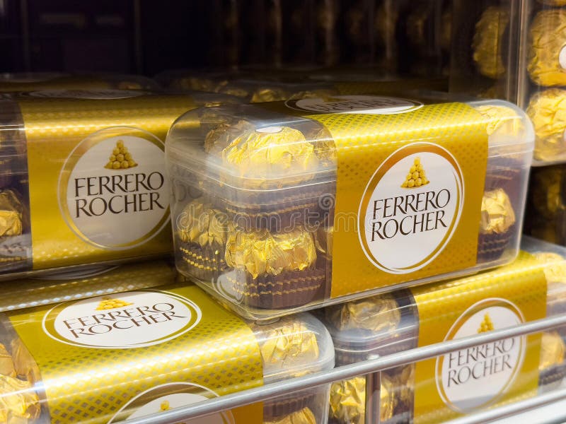 Stack of Ferrero Rocher Chocolate Boxes with Golden Wrapper Displayed ...
