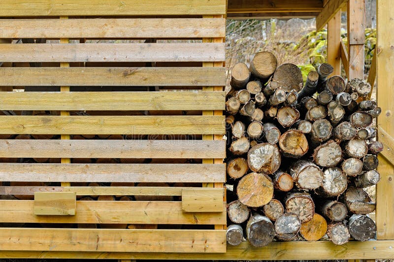 Stack of Firewood Neatly Organized in a Wooden Storage Structure in a ...