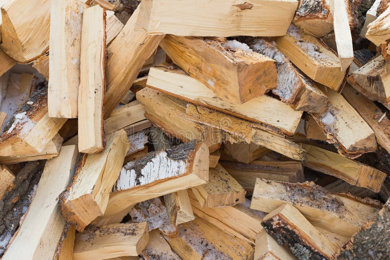 Stack of Firewood. Firewood Precisely Stacked. Background from Wooden ...