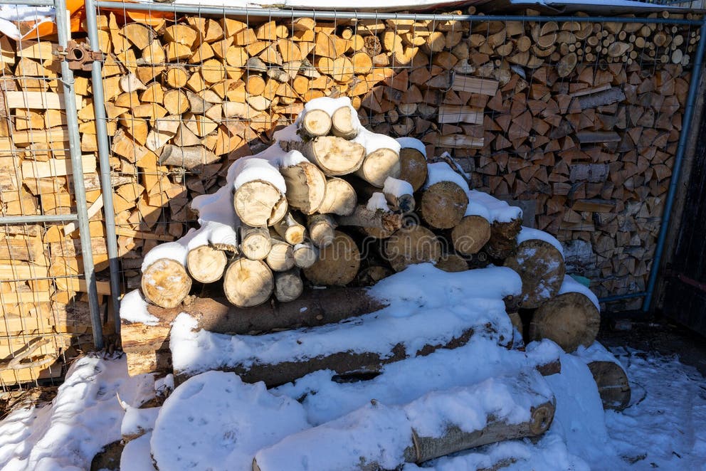Stack of Firewood with Snow in the Winter Time Stock Image - Image of ...