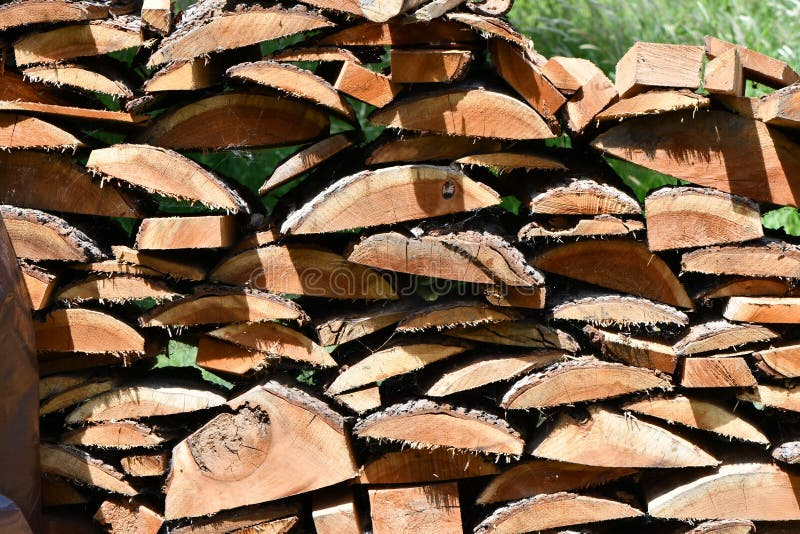 Stack of Firewood Under the Sunlight - Wooden Background Stock Image ...