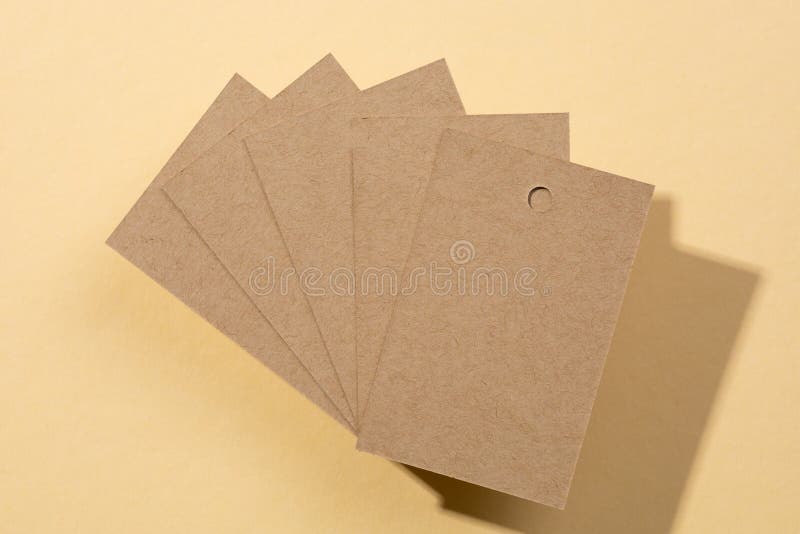 Stack of Five Blank Tags for Clothes with Little Holes in Upper Part ...