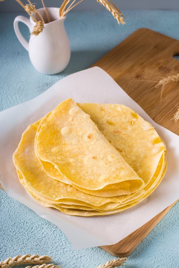 Stack of Flat Mexican Corn Tortillas on Wooden Board on Table. Vertical View Stock Image - Image ...