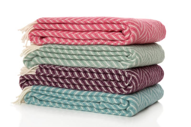 A Stack of Folded Blankets Lying on Top of Each Other Stock Photo ...