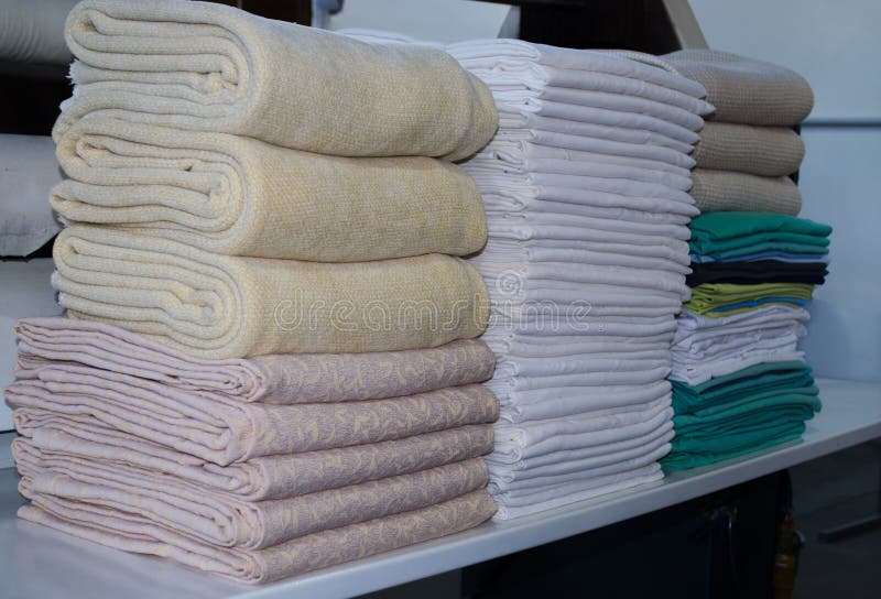 Stack of Folded Clean Sheets and Surgical Clothes in an Industrial ...