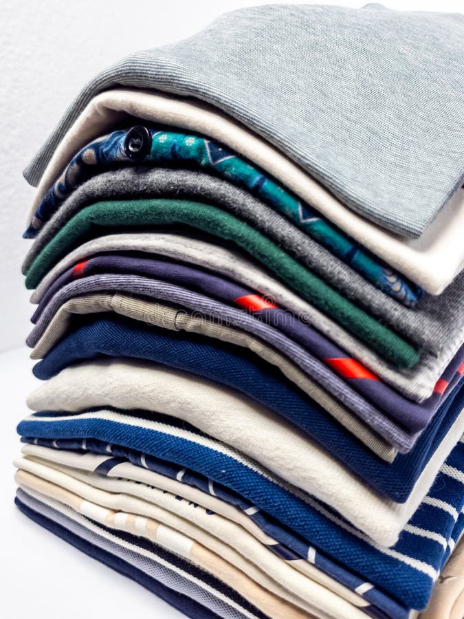 Stack of Folded Clothing in Various Colors and Textures on White Stock ...