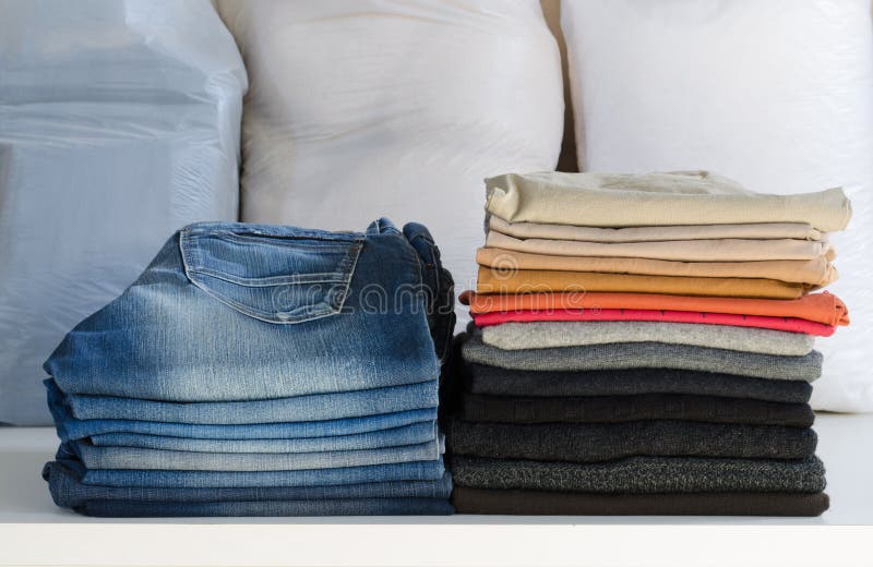 Stack of Folded Colored Clothes in a Laundry Stock Photo - Image of ...