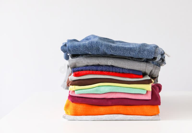 Stack of Folded Colorful Clothes. Compact Storage Organizing Stock ...