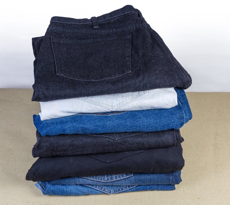 Stack of Folded Different Jeans on Textile Surface Stock Image - Image ...