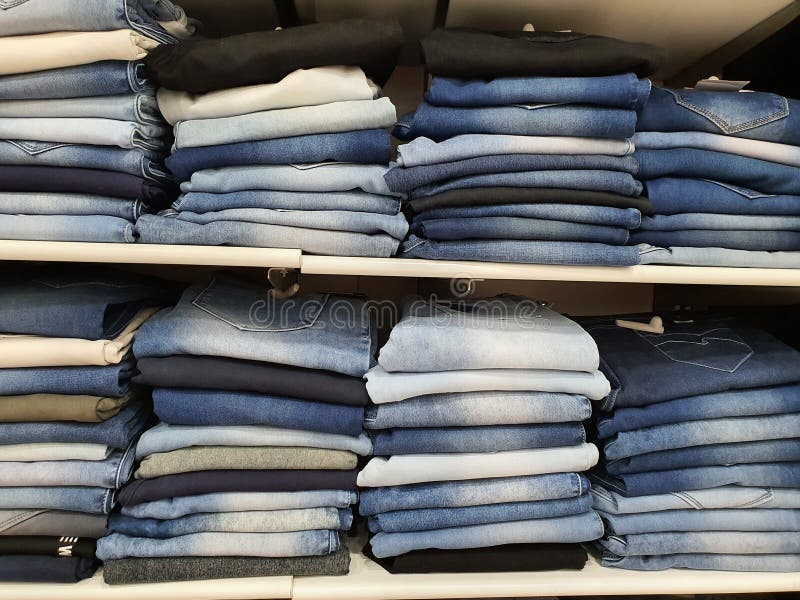 Stack of Folded Jeans in a Fashion Store Stock Photo - Image of ...