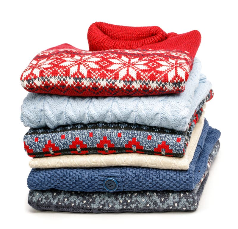 Stack of Folded Knitted Sweaters in a Store on White Background Stock ...