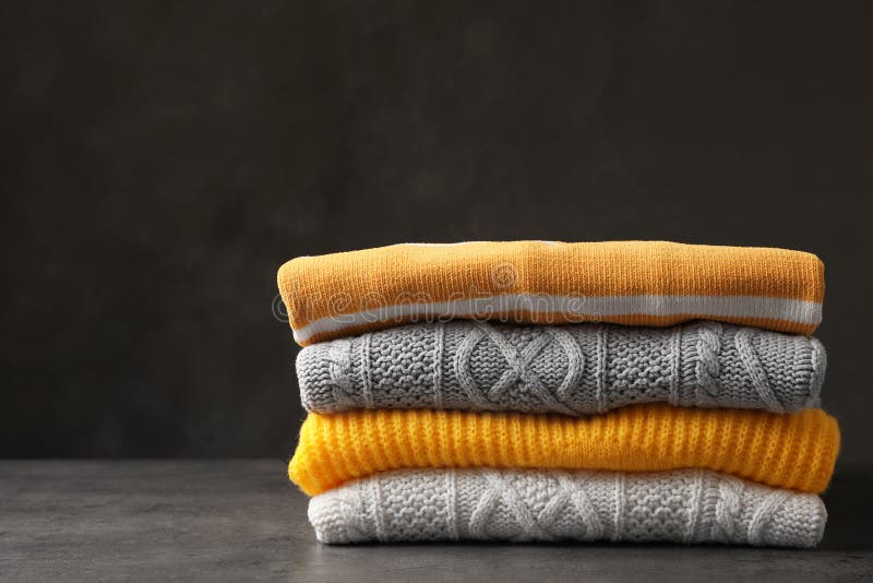 Stack of Folded Knitted Sweaters on Table Stock Image - Image of cloth ...